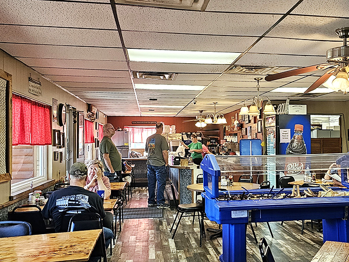 Inside, time stands still in the best possible way. The blue pool table and wood-paneled walls create the perfect backdrop for food that demands your full attention.