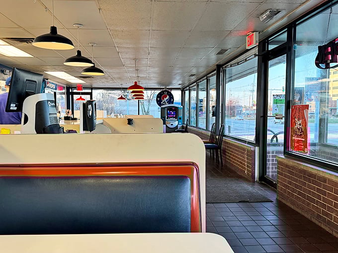 Classic diner geometry: red vinyl booths, pendant lights, and windows that frame Champaign life like Edward Hopper paintings with better breakfast options.