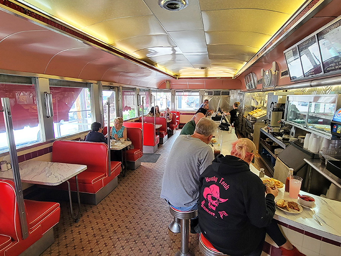 Step inside and time travel to the golden age of diners—red vinyl booths, chrome accents, and the gentle hum of conversation that feels like a warm embrace.