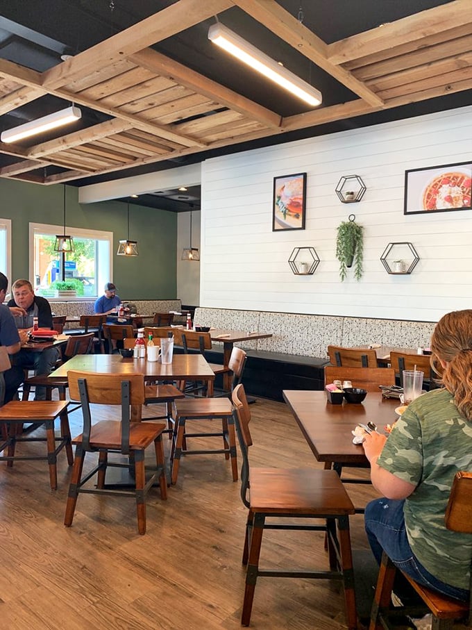 Wooden beams overhead, shiplap walls, and comfortable seating create the perfect backdrop for the serious business of breakfast indulgence.