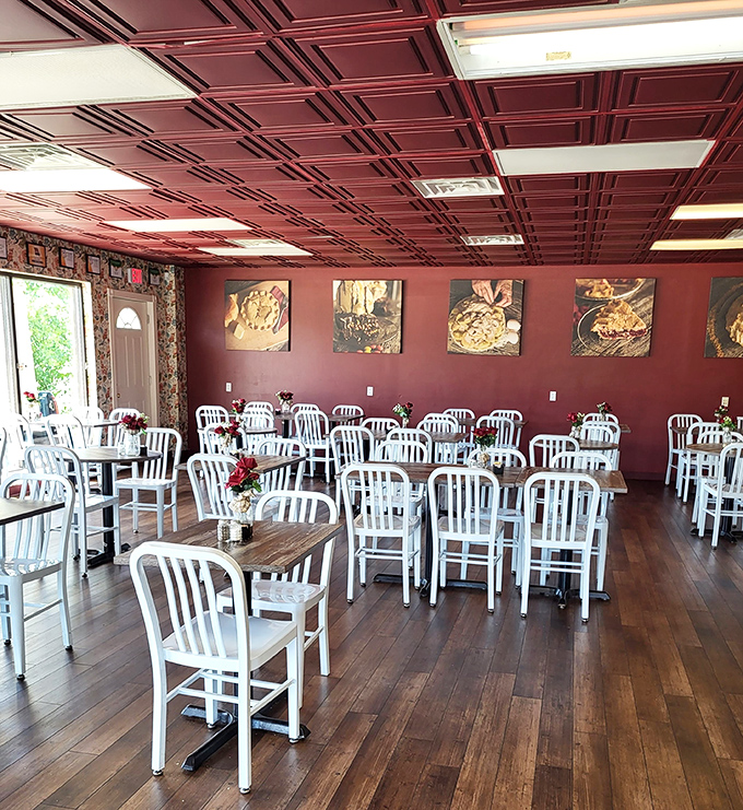Inside, burgundy ceiling tiles and wooden floors create the perfect backdrop for pie contemplation. The white chairs aren't just waiting for customers &ndash; they're awaiting conversion experiences.