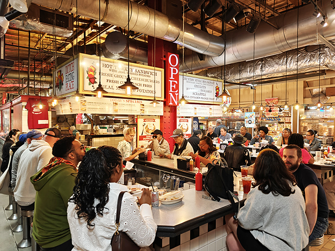 Breakfast democracy in action: locals and tourists sharing counter space, united by the universal language of exceptional pancakes and homestyle cooking.