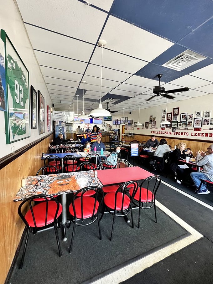 Where Philly sports legends watch over your meal from every angle. The wood paneling and memorabilia create that perfect "been here forever" vibe.