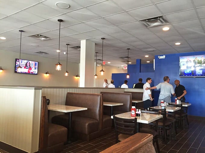 Cozy booths and warm lighting create that perfect "I could stay here all day" vibe. The kind of place where breakfast decisions become life decisions.