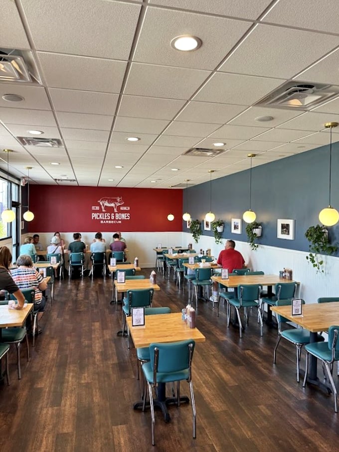 Simple, clean, and inviting&mdash;the dining room's teal chairs and warm wood tones set the stage for the flavor drama about to unfold.