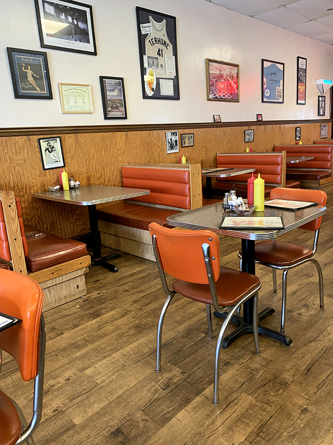 Classic orange vinyl booths and wood paneling create the perfect time capsule&mdash;where conversations flow as freely as the coffee refills.