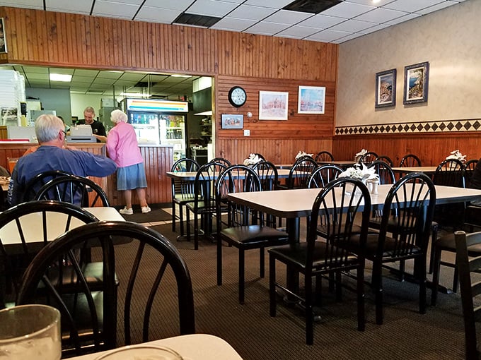 Wood paneling and simple furnishings create that classic "neighborhood Italian joint" vibe where comfort trumps trendiness every time.