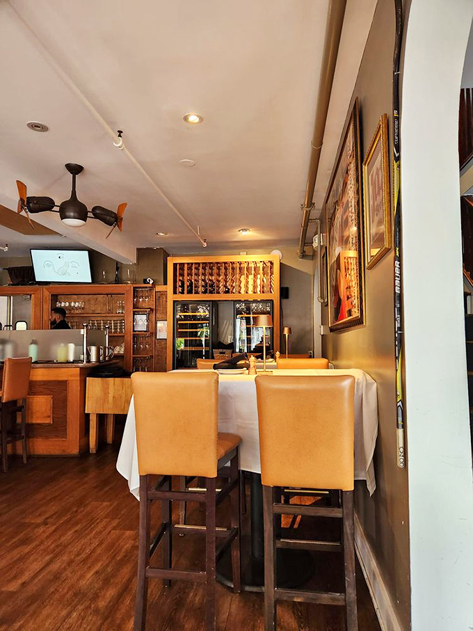 Leather chairs, white tablecloths, and warm wood tones create that perfect "I've arrived somewhere special" feeling without any pretentious nonsense.