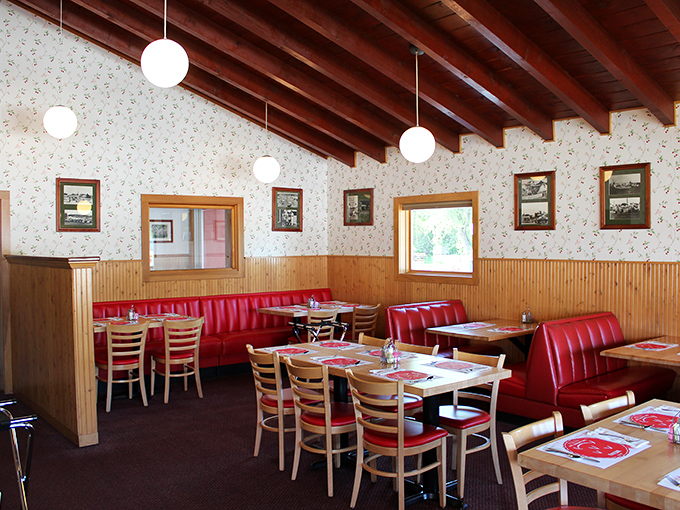 Step inside to discover red vinyl booths and warm wood paneling that whisper stories of countless satisfied diners.