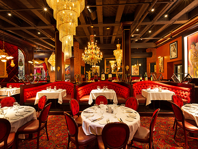 Red velvet booths, crystal chandeliers, and enough ambiance to make you sit up straighter. This isn't dinner &ndash; it's dinner theater.