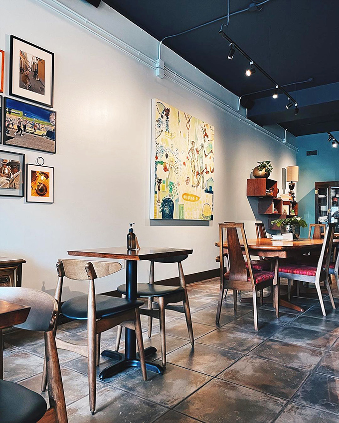 Inside, modern meets nostalgia with wooden tables, art-adorned walls, and the kind of atmosphere that makes you want to linger over coffee all afternoon.