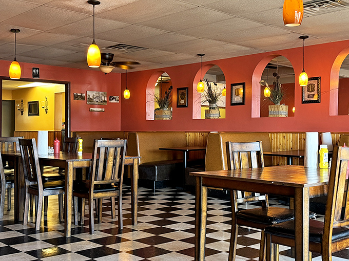 Warm terracotta walls, pendant lighting, and that classic checkered floor create the perfect backdrop for the burger epiphanies that regularly occur here.