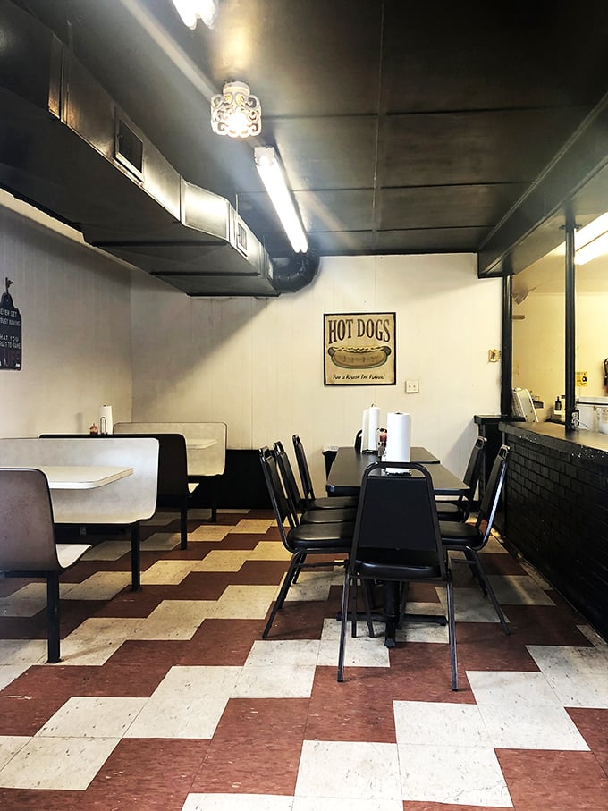 That checkerboard floor has witnessed countless burger epiphanies. The simple booths invite you to focus on what really matters: the food.