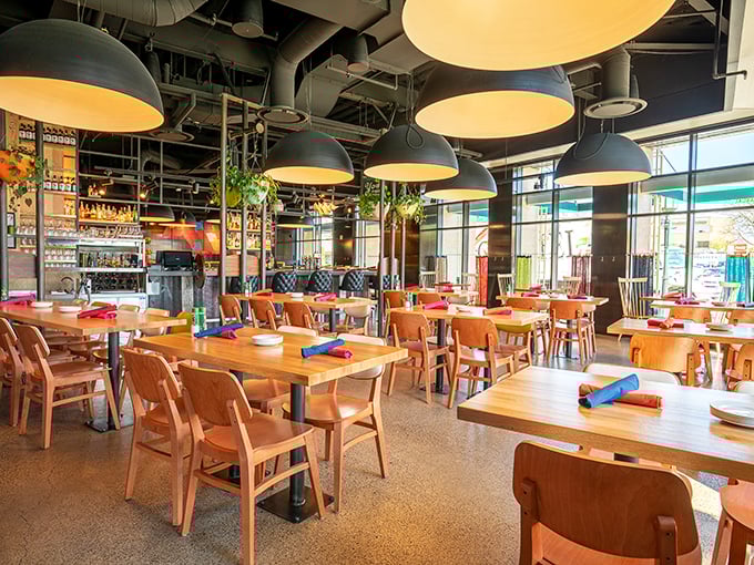 Industrial chic meets nautical comfort inside Hazel's, where pendant lights cast a warm glow over wooden tables ready for seafood feasts.