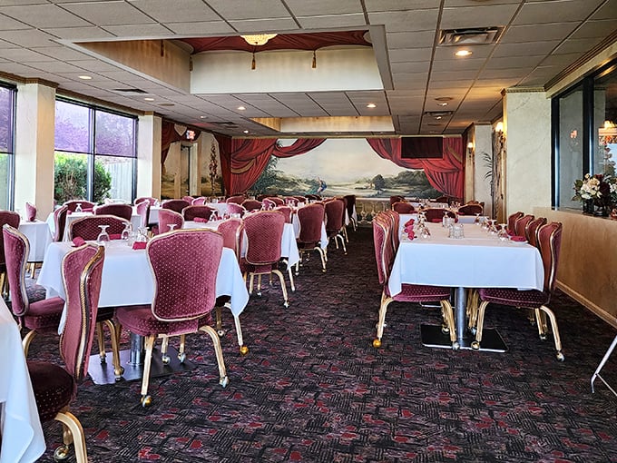 Step into a dining room where time stands still. Those burgundy chairs have witnessed countless celebrations, first dates, and "just because it's Friday" feasts.