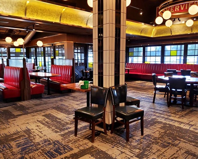 Red leather booths and warm lighting create the perfect backdrop for comfort food conversations. Retro ambiance with modern sensibilities.