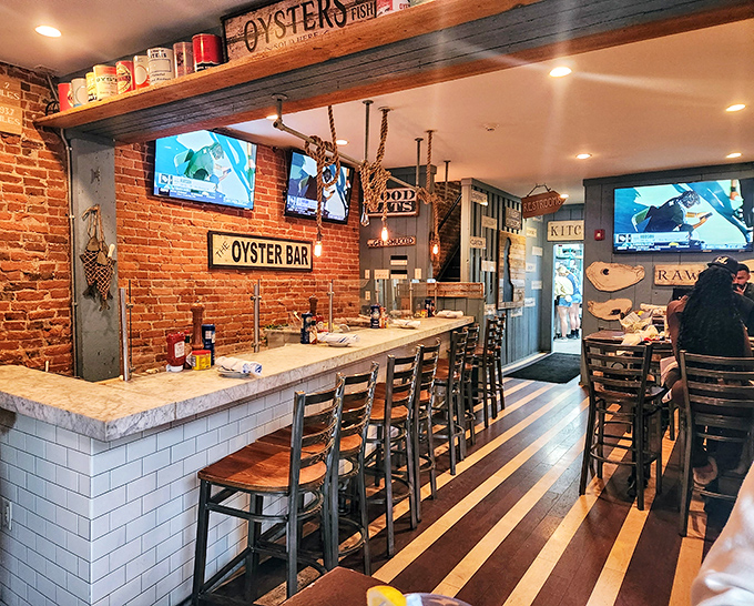Exposed brick meets nautical charm at the oyster bar, where the striped wooden floor guides you to seafood nirvana like a delicious yellow brick road.