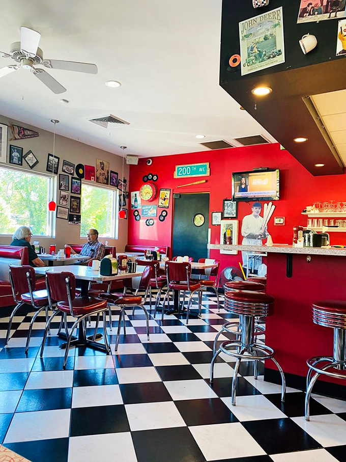 Step inside and the 1950s never ended. Red walls, chrome accents, and that iconic checkered floor create the backdrop for countless Wisconsin breakfast memories.