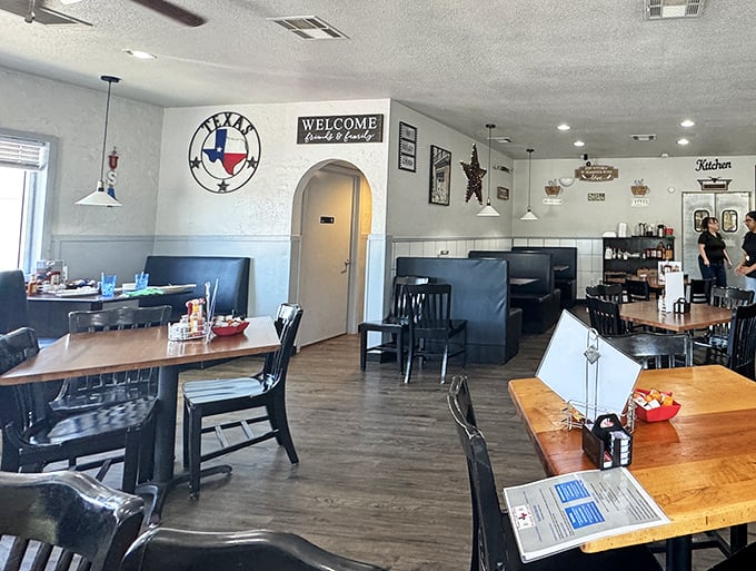 Classic blue booths and Texas pride on full display. This isn't interior design &ndash; it's comfort engineering at its finest.