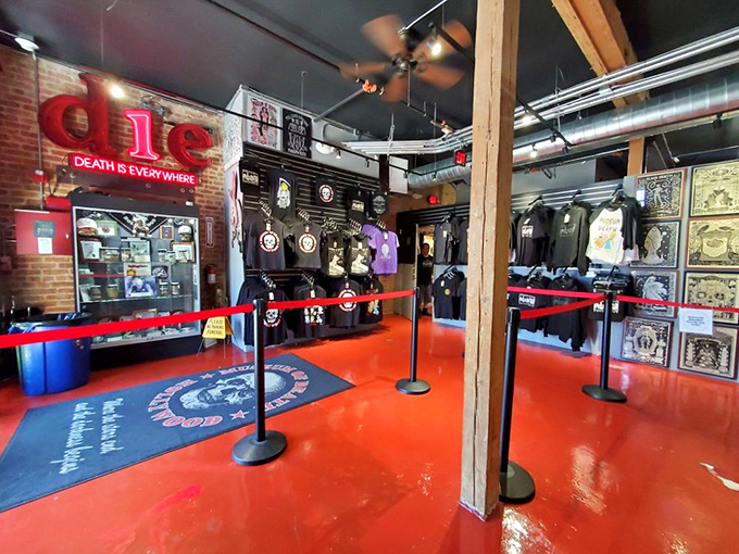 "Death is everywhere" proclaims the glowing neon sign that welcomes visitors to the museum's entrance area. The bright red floor seems like an intentional design choice.