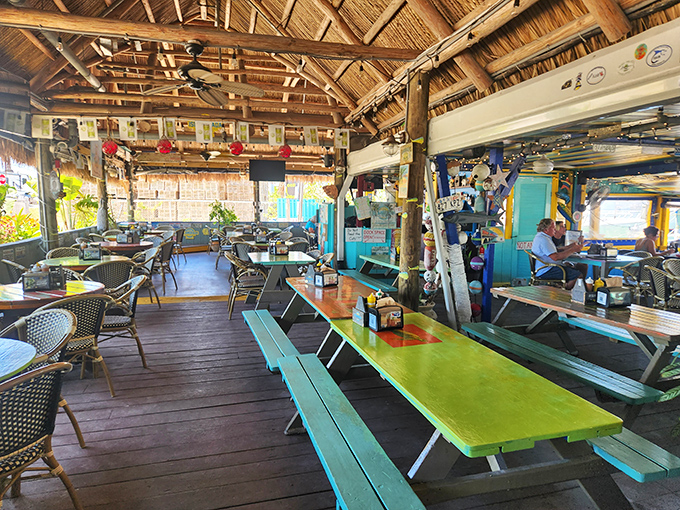 Colorful picnic tables that look like they were painted by Jimmy Buffett after his third margarita. The perfect backdrop for seafood memories. 