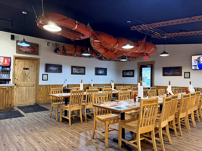 Fishing nets suspended from the ceiling aren't just decoration&mdash;they're a promise of the authentic maritime experience waiting at your wooden table. 