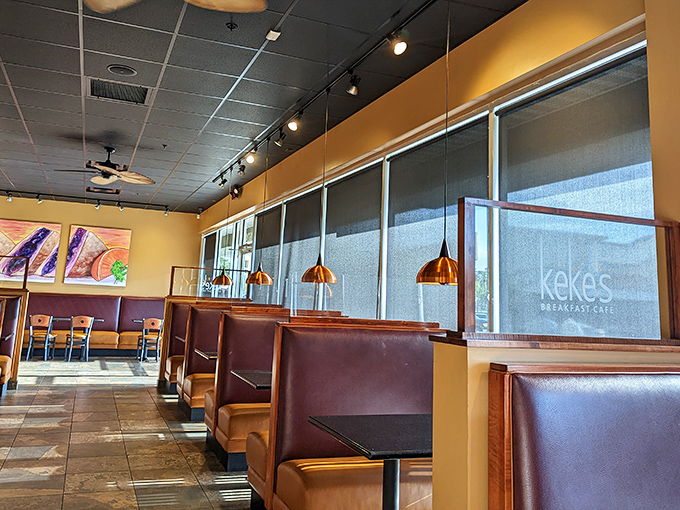 Warm lighting and cozy booths create the perfect setting for morning conversations and memorable meals.