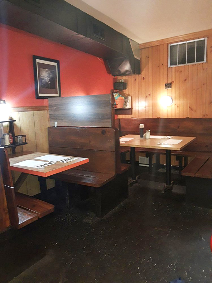 Cozy booths and warm wood paneling create the perfect atmosphere for lingering over coffee conversations.