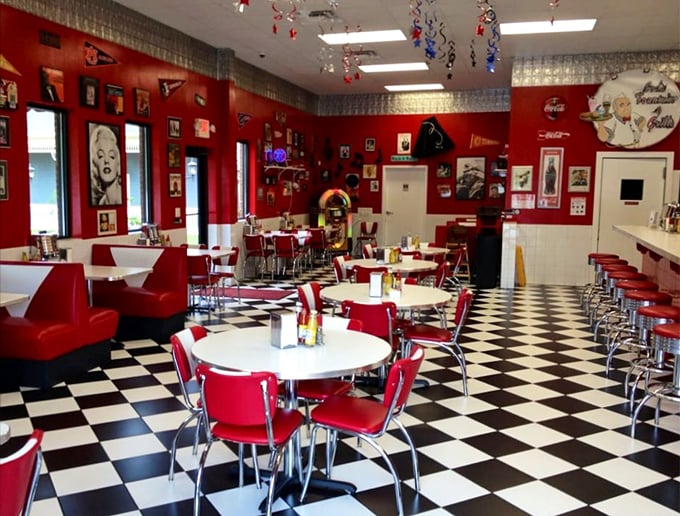 Step inside and the 1950s greets you with open arms: checkered floors, fire-engine red booths, and walls that tell America's love story with cars and rock 'n' roll.