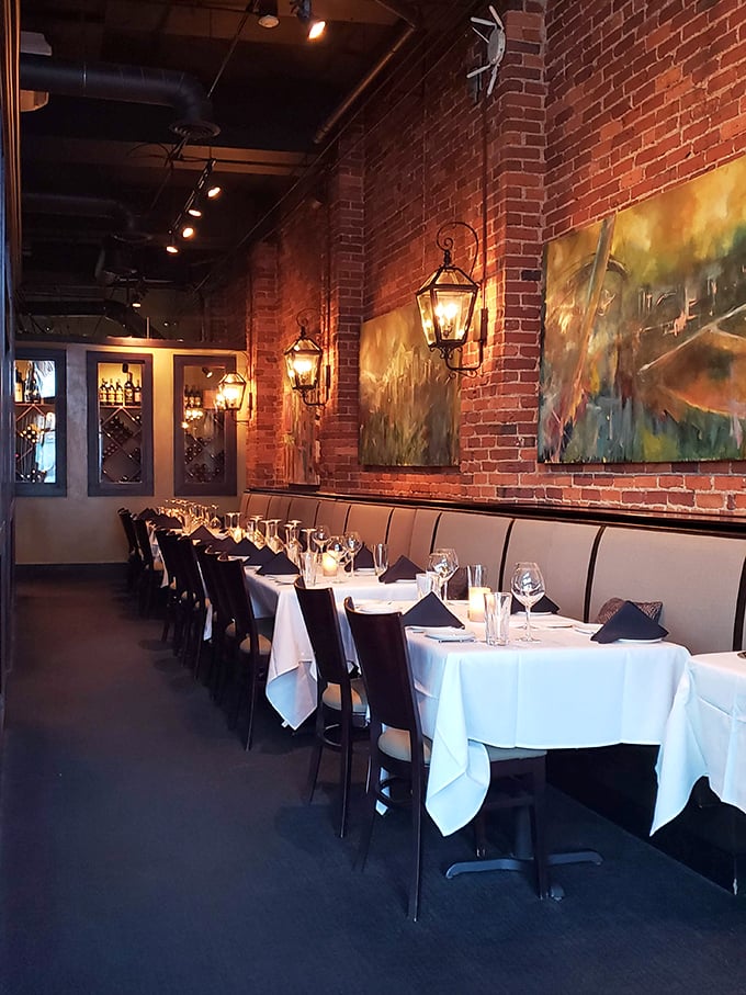 Exposed brick walls, warm lantern lighting, and crisp white tablecloths create that perfect "special occasion that doesn't have to be special" atmosphere.