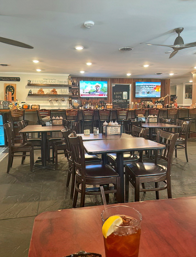 Inside, wooden tables and a welcoming bar create that perfect "I might stay here all afternoon" vibe that every great barbecue joint needs.