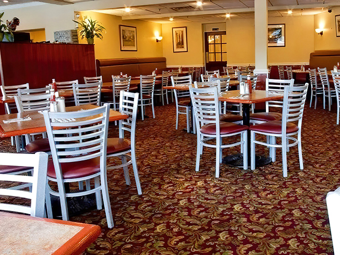 White chairs, burgundy booths, and that classic patterned carpet &ndash; the dining room at Penrose has mastered the fine art of unpretentious comfort.