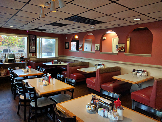 Classic burgundy booths and warm terracotta walls create that perfect diner atmosphere&mdash;where conversations flow as freely as the coffee.