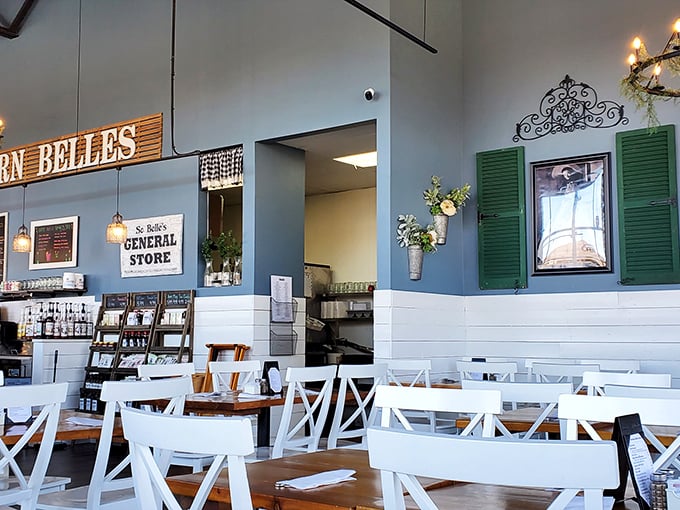 Blue walls, green shutters, and white chairs create that "grandma's house meets modern farmhouse" vibe that makes you instantly comfortable.