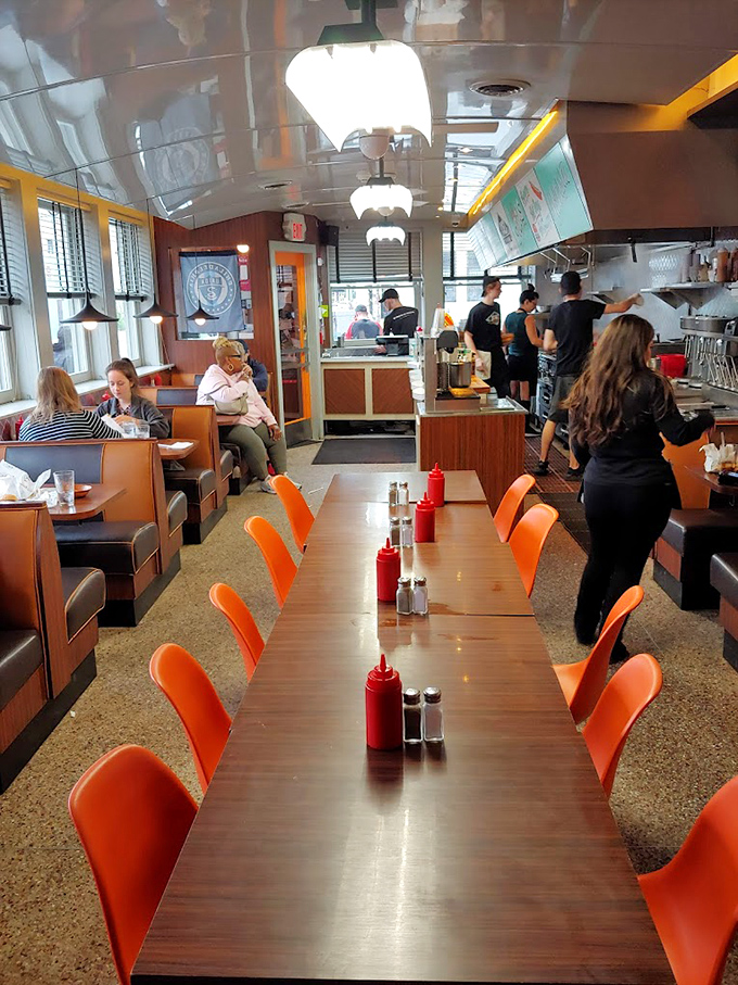 Inside, those orange chairs and wood-paneled booths aren't just seating&mdash;they're front-row tickets to the greatest show in comfort food.