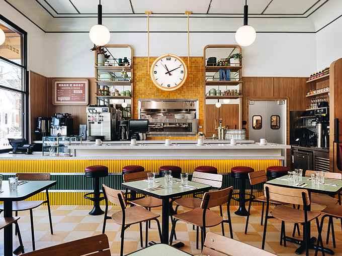 Mid-century modern meets comfort food heaven in this thoughtfully designed space where every seat promises a front-row view of culinary magic.