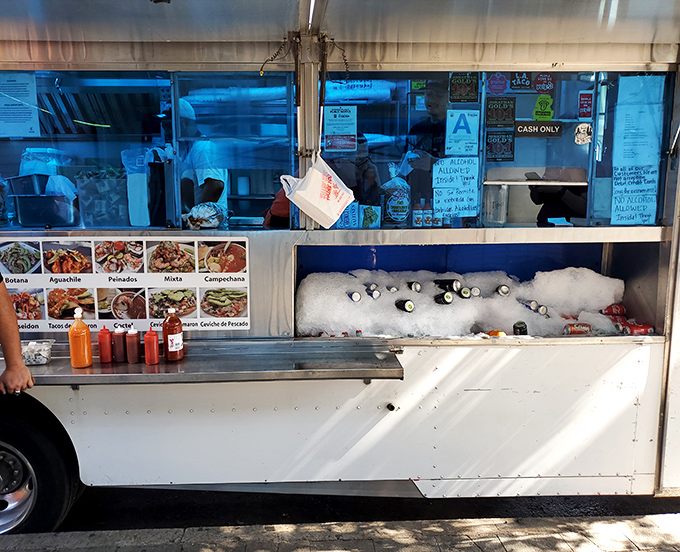 Where magic happens! The humble service window offers a glimpse into the bustling kitchen where seafood dreams are crafted to perfection.