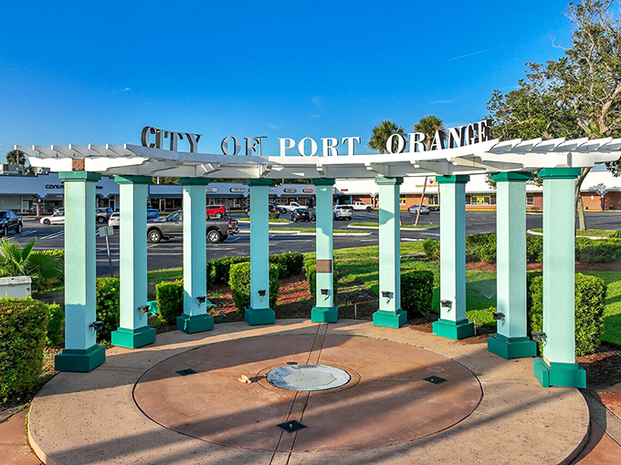 The mint-green pillars of Port Orange's welcome sign stand like sentinels of serenity, promising visitors they've officially entered the slow lane.