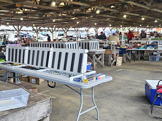 Folding tables and striped benches await the next wave of bargain seekers. Every surface holds potential for that perfect find.