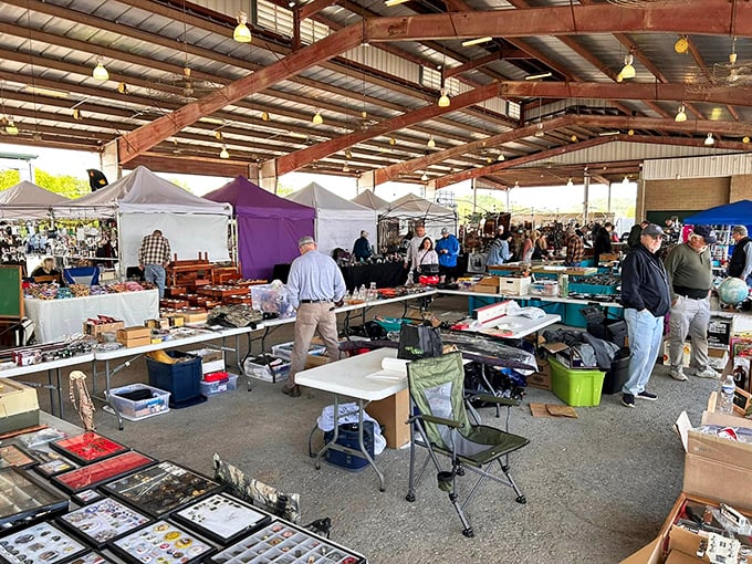 Beneath the rustic beams, shoppers navigate a maze of possibility. Every table holds someone's past and another's future&mdash;the beautiful chaos of flea market magic.