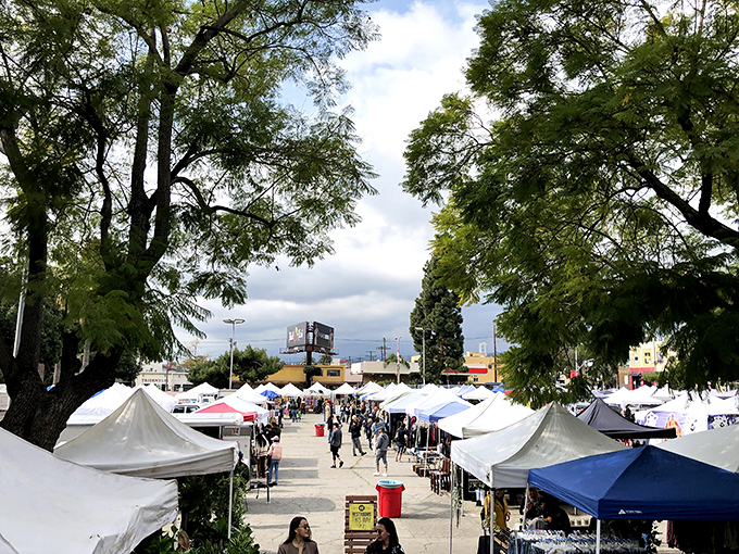Rows of white tents create shopping boulevards where vintage dreams come true under California sunshine.