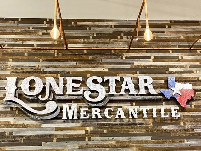 More than just a sign&mdash;it's a promise of treasures to come, mounted on a reclaimed wood wall that's a preview of the rustic aesthetic inside.