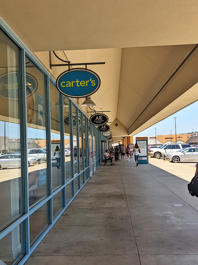 Retail therapy in full swing as shoppers stroll beneath the covered walkways. Carter's and American Eagle beckon with promises of discounted treasures.
