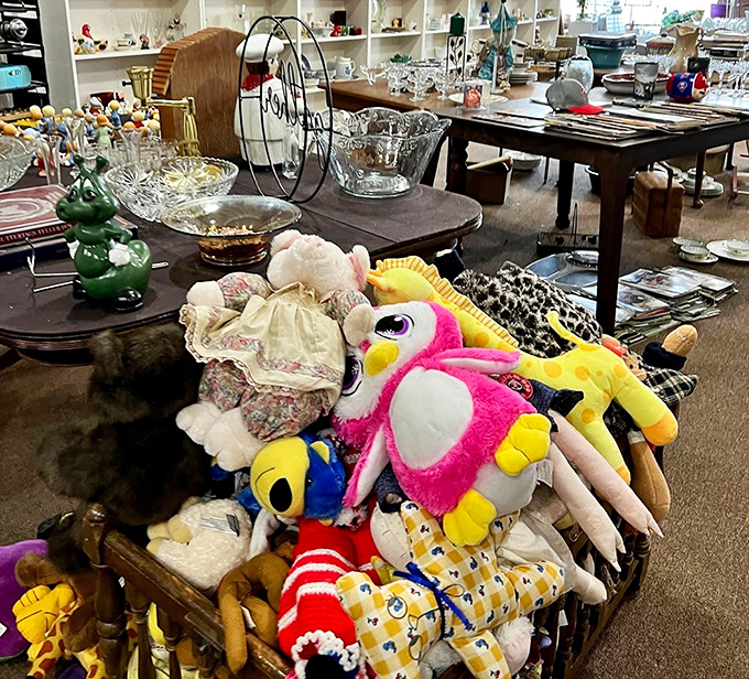 A basket overflowing with plush companions waiting for their second chance at love. That pink penguin seems to be eyeing you specifically.