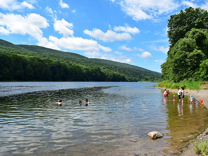 Summer's greatest pleasure: cooling off in crystal-clear waters while mountains stand guard. No Instagram filter could improve this natural perfection.