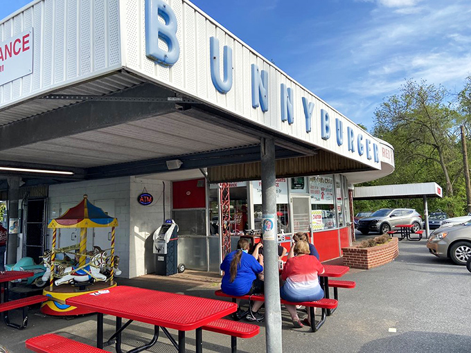 Red picnic tables under the awning offer the perfect perch for people-watching while savoring a taste of Pennsylvania's roadside heritage.