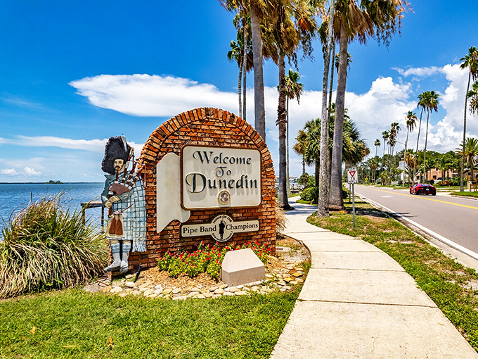 Not every welcome sign comes with its own bagpiper! Dunedin's Scottish heritage stands proudly against a backdrop of swaying palms and Gulf waters.