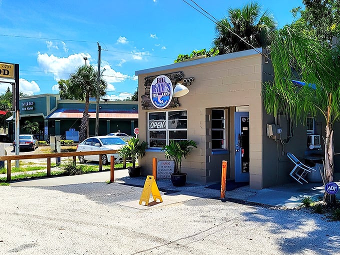 This unassuming blue building houses Big Ray's Fish Camp, where the grouper sandwich extends well beyond the boundaries of ordinary bread.