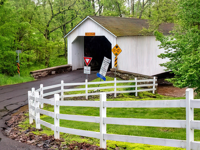 A classic white covered bridge stands like a postcard from the past. Some things in life just never go out of style!