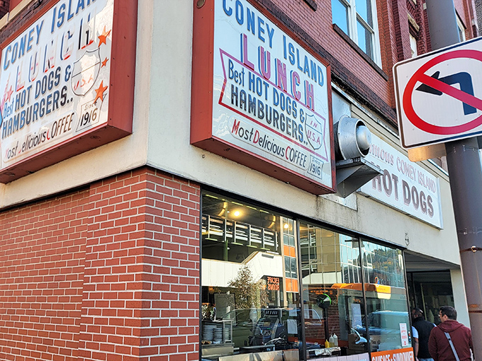 Coney Island Lunch's bold signage stands as a beacon of hope for hungry travelers &ndash; "Best Hot Dogs & Hamburgers" isn't just a claim, it's a mission statement.